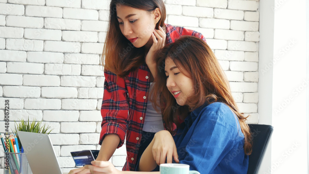 Asian colleague friendship at work with smiling face. Happiness two ...