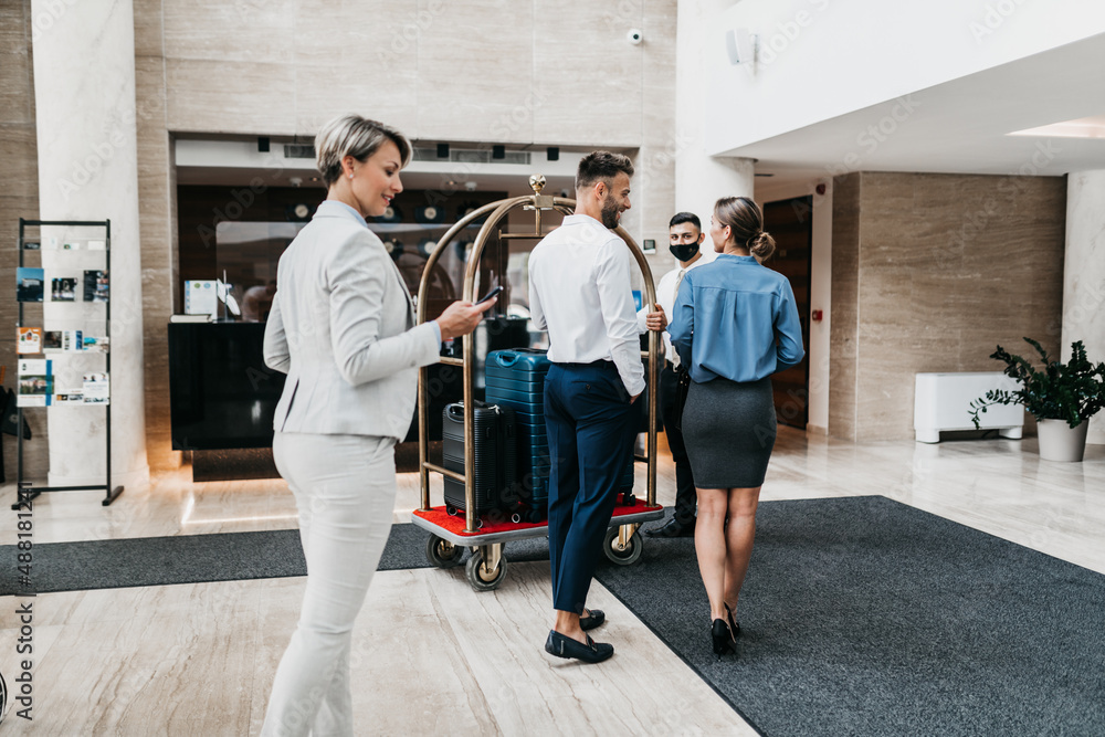 People at the reception of a hotel checking in. Business trip. Stock ...