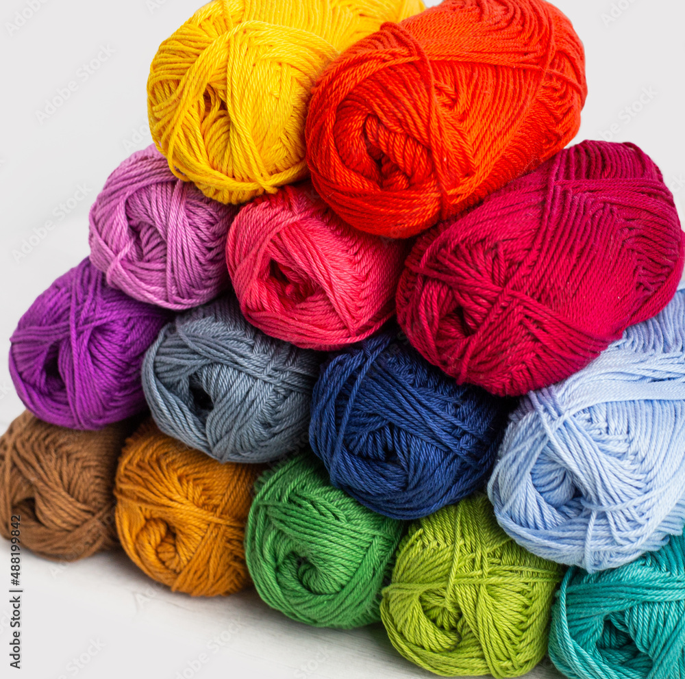 Rainbow colored skeins of yarn Stock Photo | Adobe Stock
