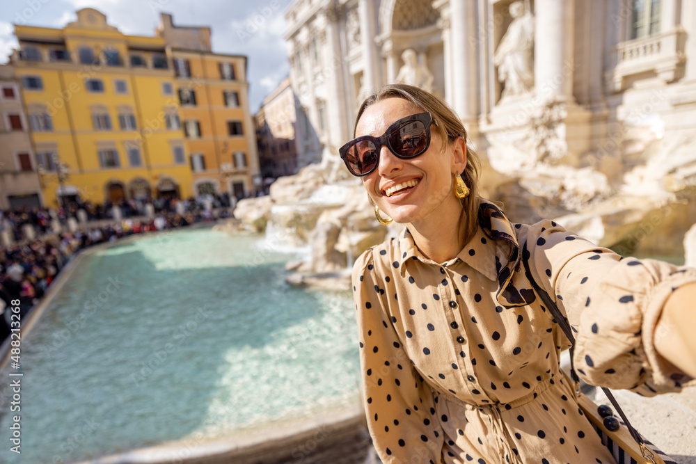 Woman visiting famous di Trevi fountain in Rome. Traveling Italy on a ...