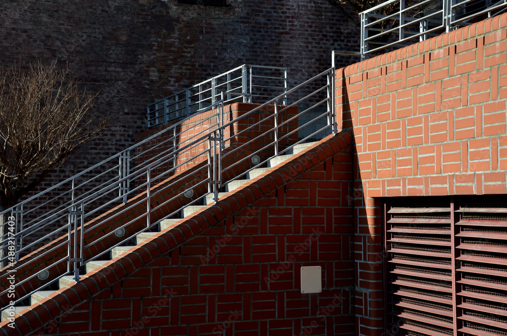 stairs and railings of exposed brick smooth surface. Metal railings and ...