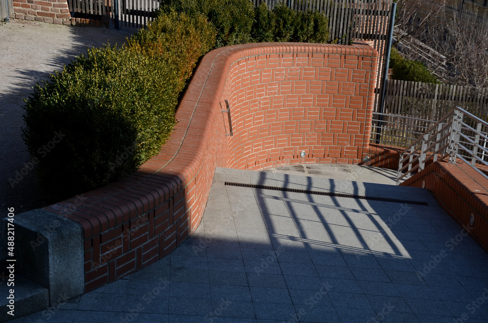 stairs and railings of exposed brick smooth surface. Metal railings and ...