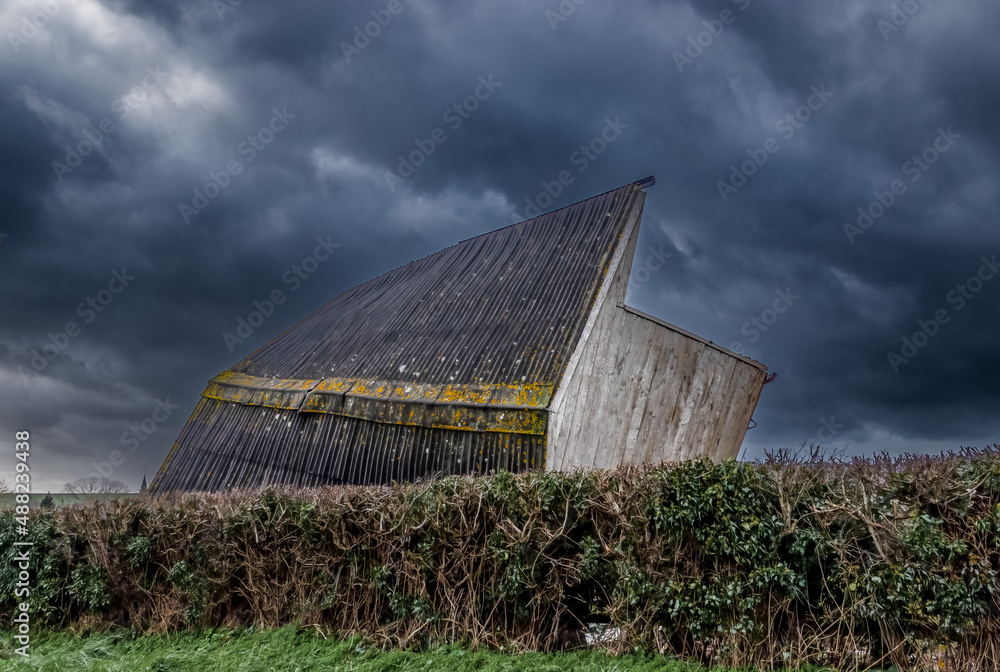 wooden horse stables blown over on to its side strong winds of a storm ...