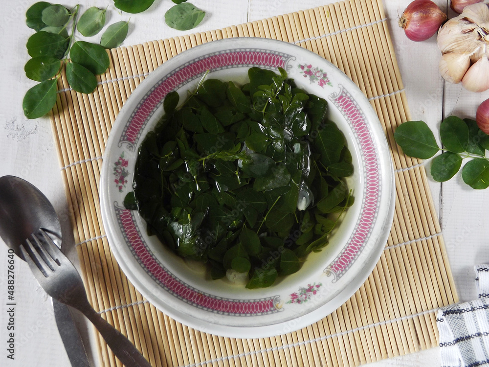 Moringa clear soup or sayur bening daun kelor is Indonesian traditional ...