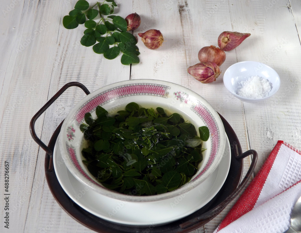 Moringa clear soup or sayur bening daun kelor is Indonesian traditional ...