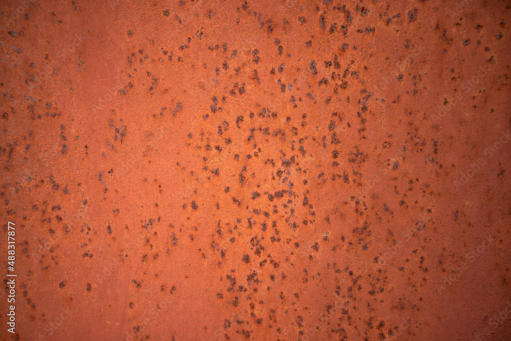 The iron wall is red with traces of rust. Iron background for the text ...