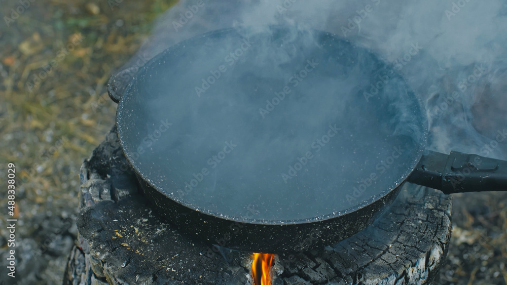 Swedish or finnish log candle. Fire burning from inside the wooden log ...