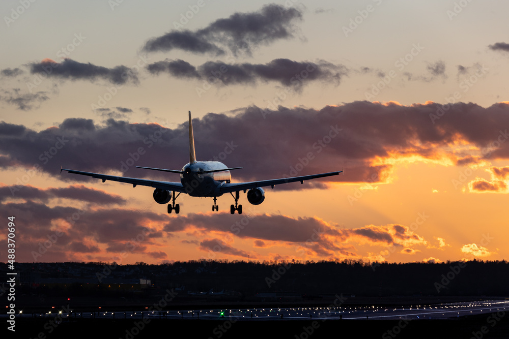 Aircraft landing at Stuttgart Airport, landing gear down, against ...
