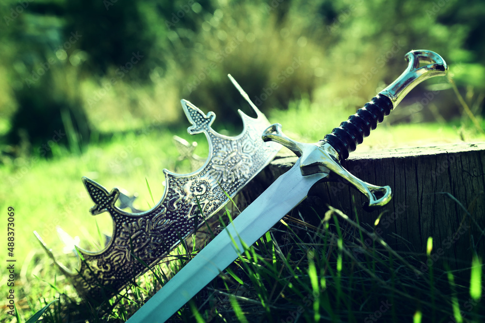 mysterious and magical photo of gold king crown and sword in the ...