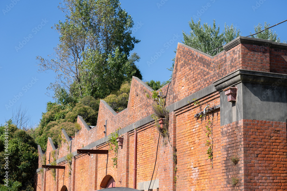 Historic derelict New Zealand Shipping brick building at Tokomaru Bay ...