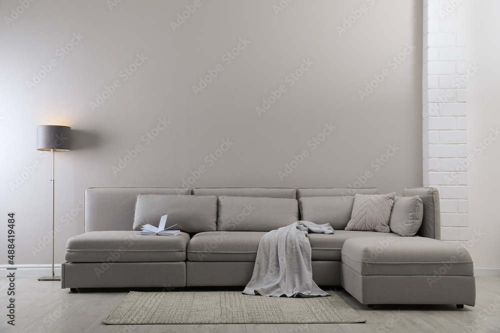 Large grey sofa in living room. Interior design Stock Photo | Adobe Stock