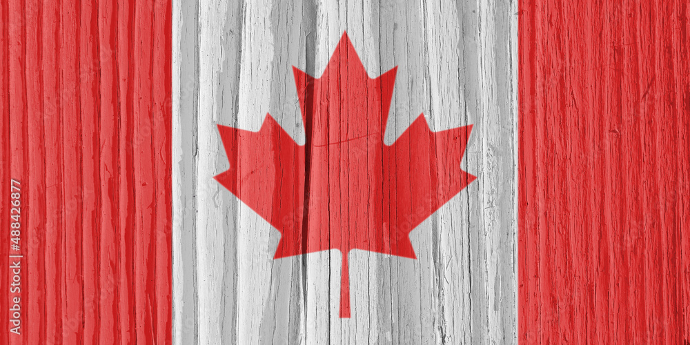 Canadian flag on a dry wooden surface. Natural background, wallpaper or ...