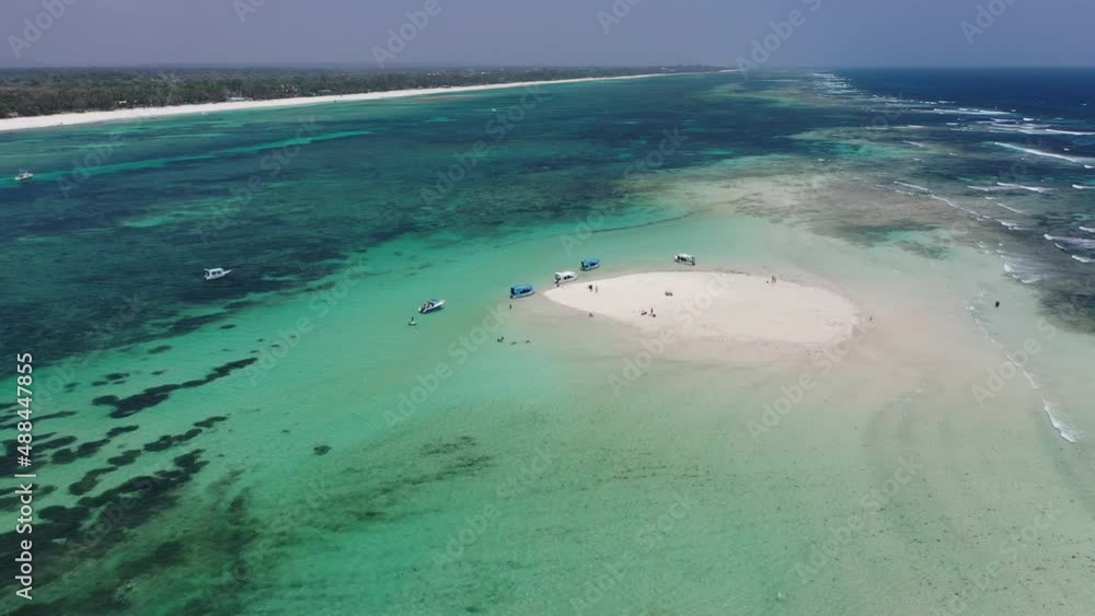 sandbank with white sand and boats around small island Drone view ...