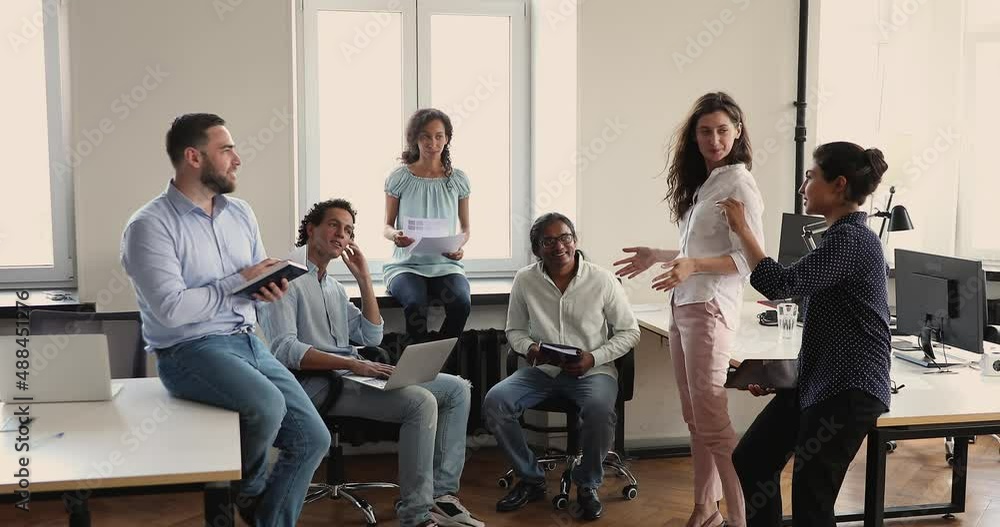 Diverse company employees brainstorming, working on collaborative ...