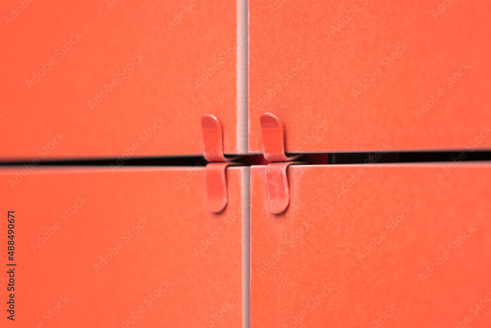 REd square ventilated ceramic panels installed on the facade of the ...