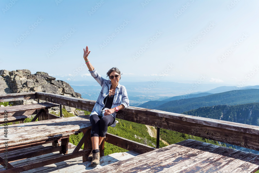 Hiker Woman Sitting and Waving in Rila Mountain with Stunning View ...
