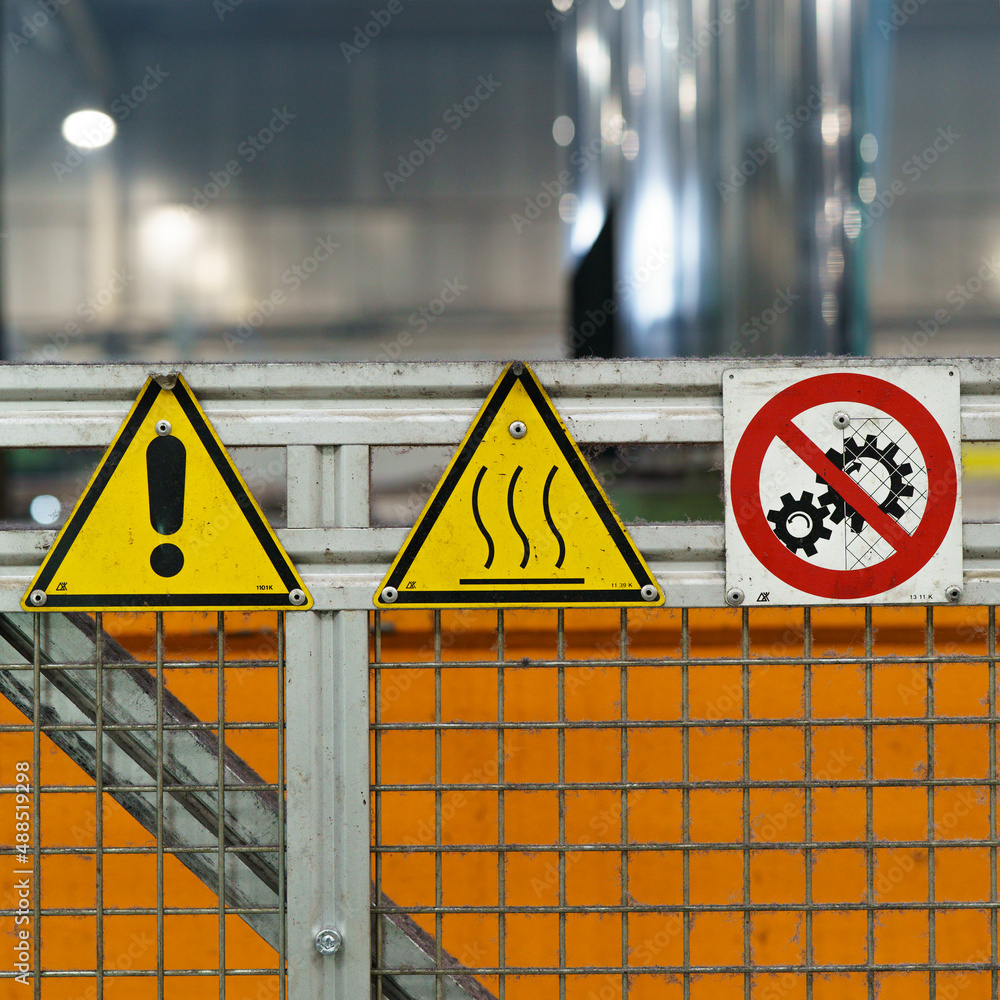 Poster Old industrial safety sign. Warning safety sign inside a factory ...
