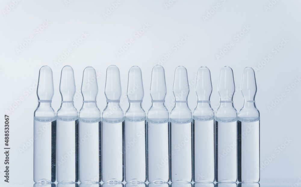 Glass medical ampoule vial for injection. Medicine is dry white drug ...