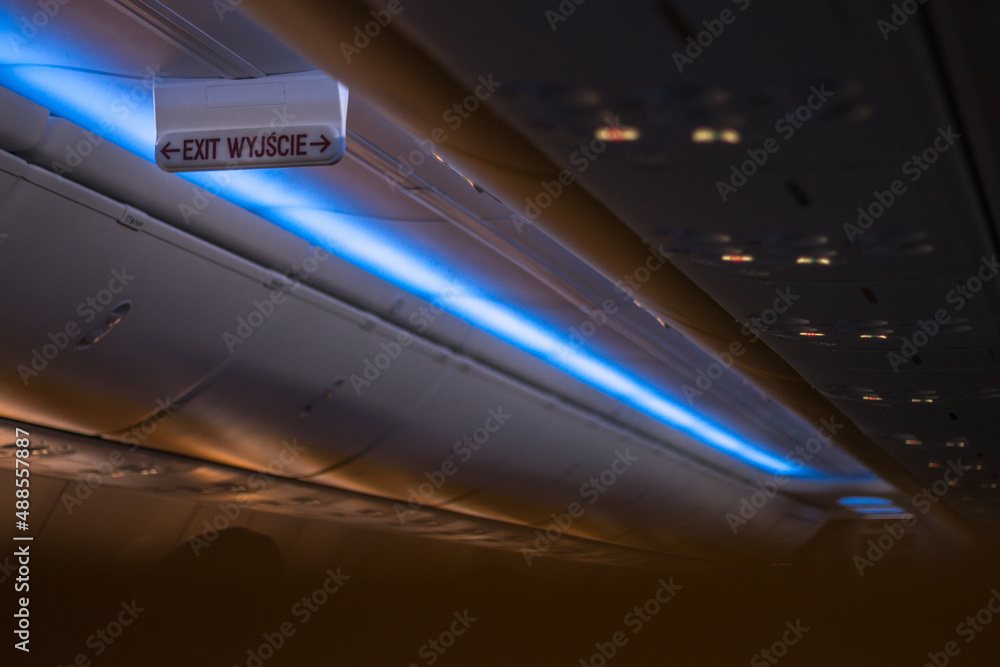 Emergency exit sign on a plane Stock Photo | Adobe Stock