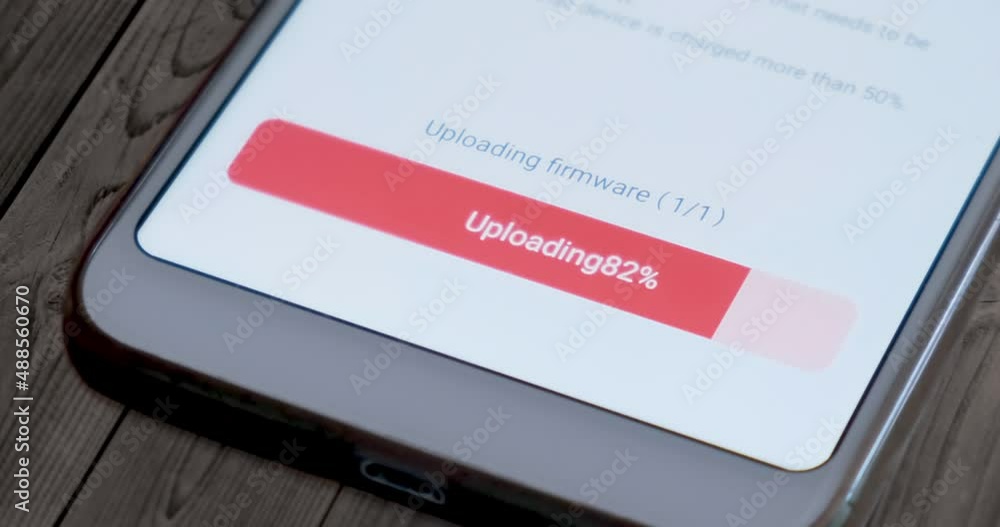 Progress bar with percentage shows phone uploading firmware update to ...
