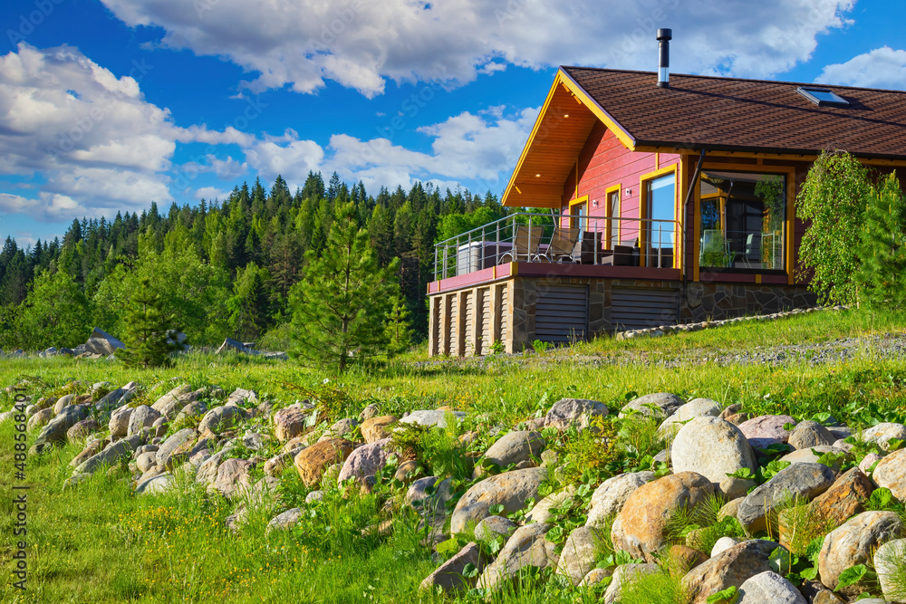 Territory country house. Wooden house in cottage town. Landscape design ...