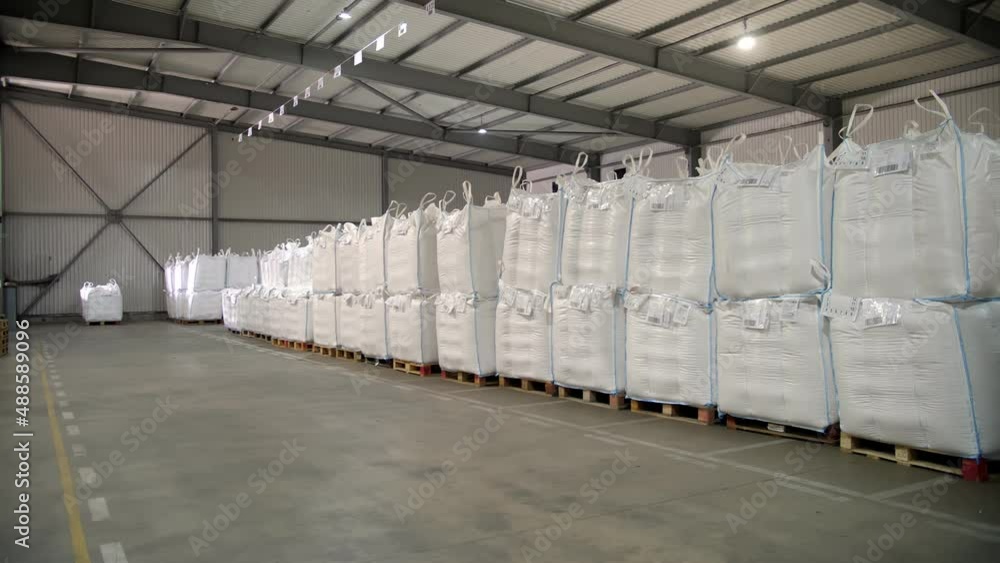 agricultural storage. warehouse. bags of corn seed, grain. large ...
