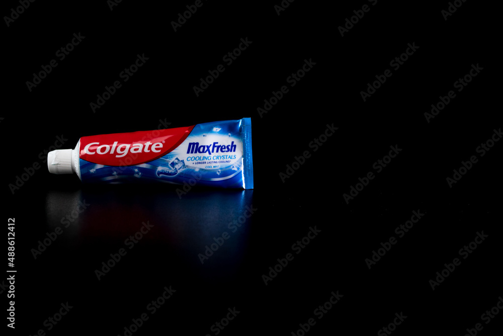 Colgate MaxFresh toothpaste tube on black background in Bucharest ...
