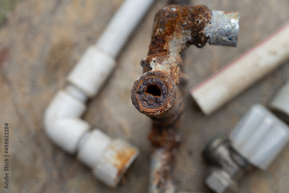 Rusted and oxidized galvanized water pipe, closeup of waste in old ...