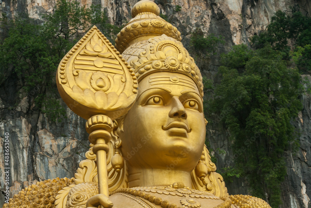 Close up of face of the Murugan Statue (Tugu Dewa Murugga) in Batu ...