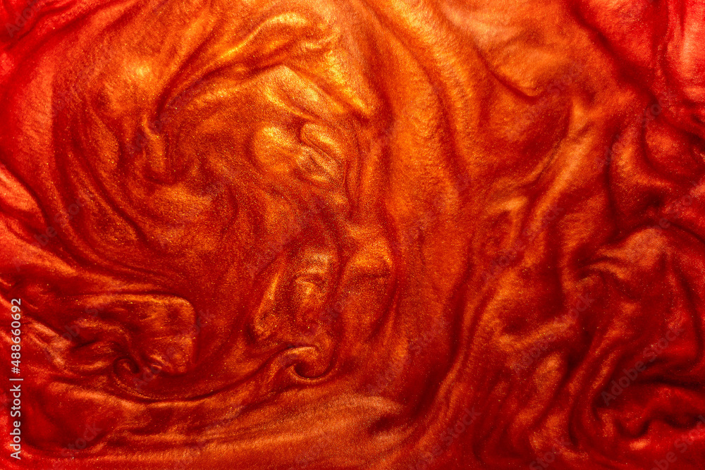 Defocus. Detailed particles of red luster flow with a small depth of ...