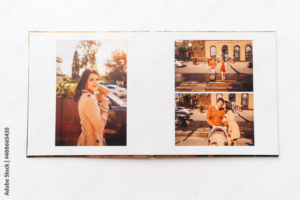 pages of a photobook from a family photo shoot. Stock Photo | Adobe Stock