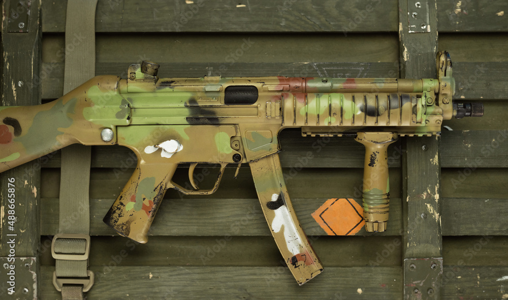 mp5 automatic rifle next to ammunition box and other military ...