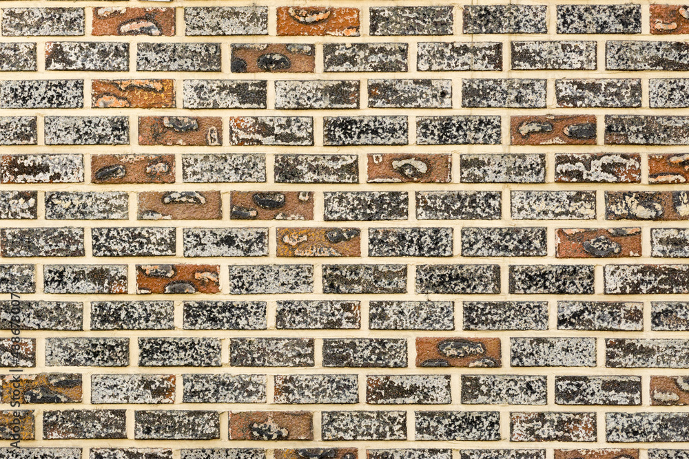 Red and dark gray bricks installed on the wall of the house Stock Photo ...