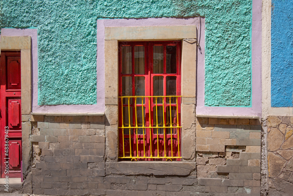 Scenic cobbled streets and traditional colorful colonial architecture ...