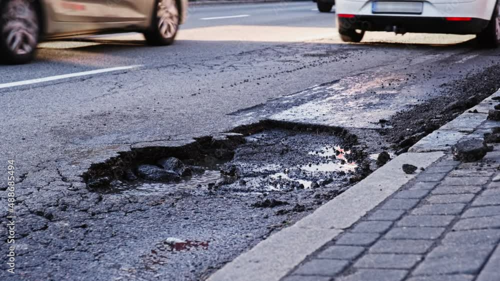 Vehicles Driving Over Deep Large Erosion Hole in City Street Asphalt ...
