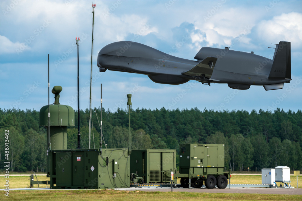 Northrop Grumman RQ-4 Global Hawk taking off from an airfield equipped ...
