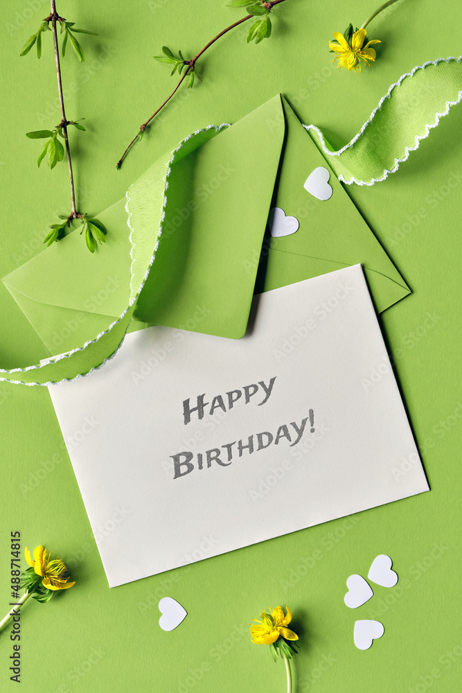 Happy Birthday text on card. Spring background in shades of green ...