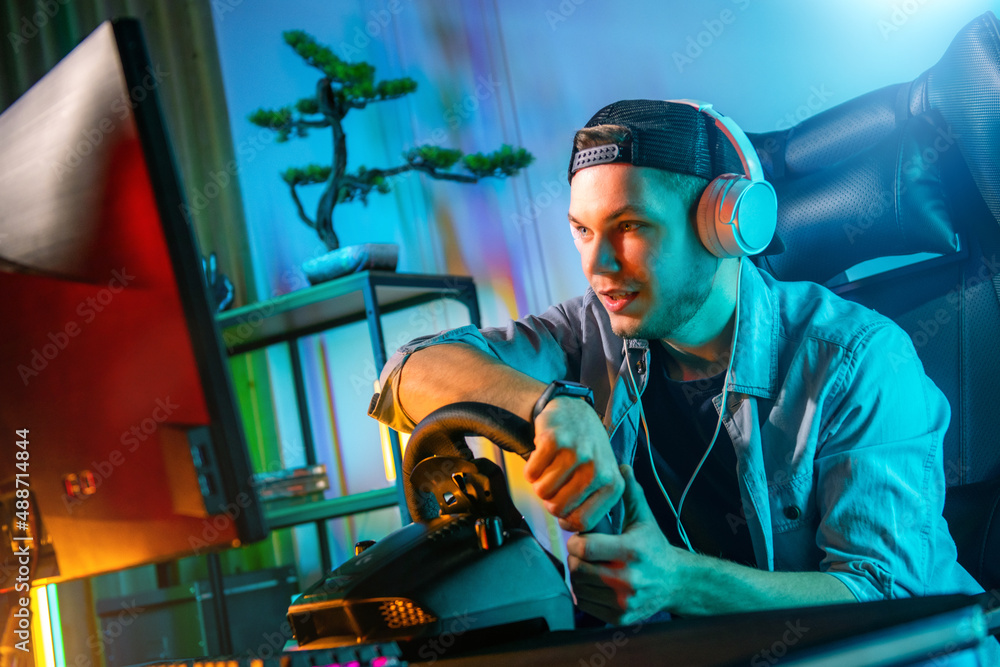Pro Gamer Man playing computer games. Car Racing Online Video Game ...