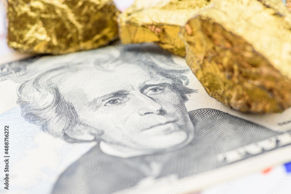 Precious metals and currency investment concept : Gold colored iron ore ...