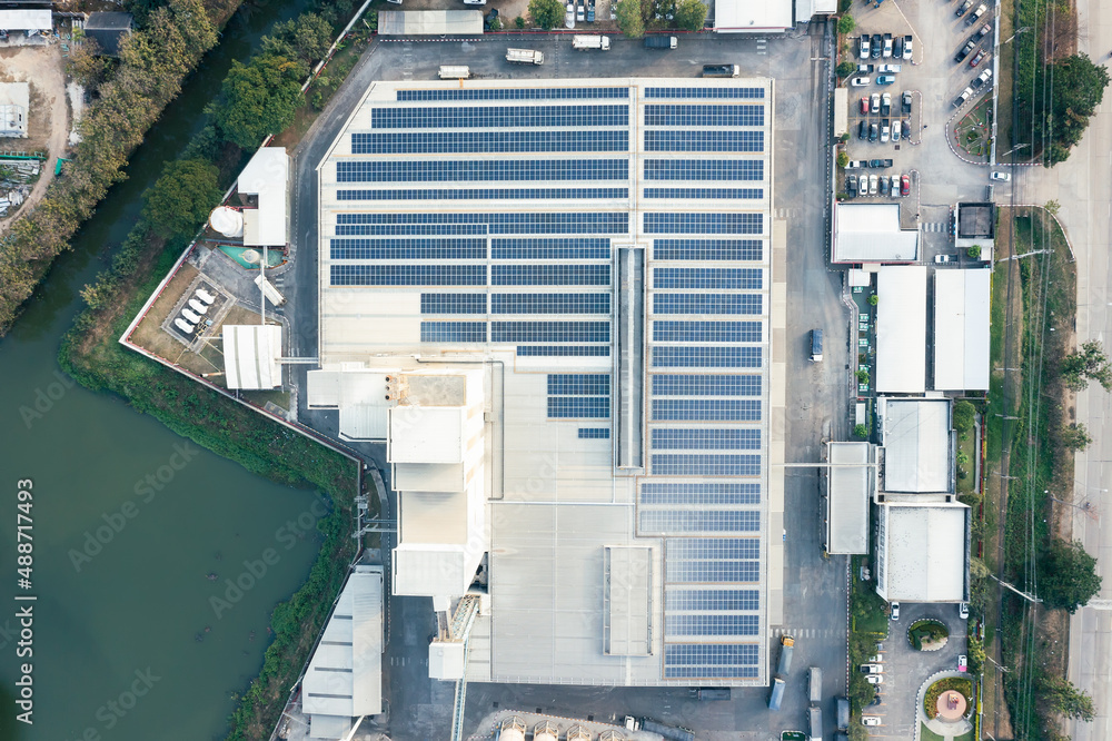 Eco building or factory in aerial view consist of solar or photovoltaic ...