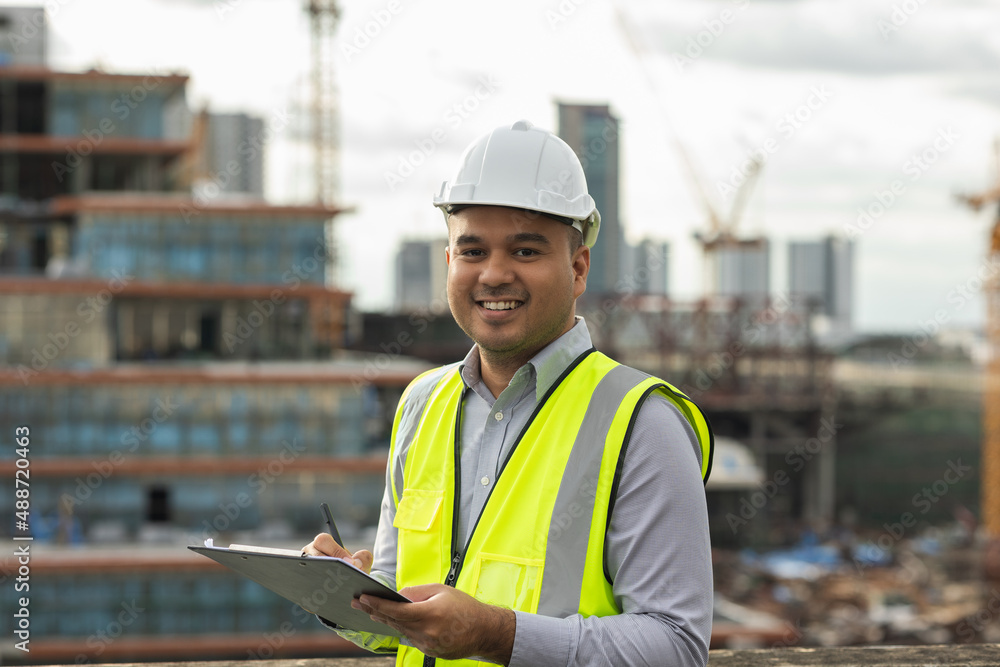Inspector engineer man or architect with clipboard with white safety ...
