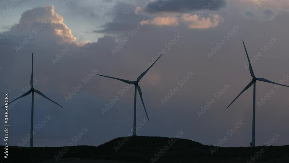 group of windmills for renewable electric energy production. Production ...