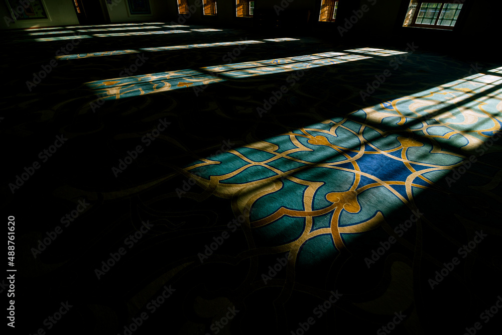 Islamic background. Shadows of window on the carpet in a mosque Stock ...