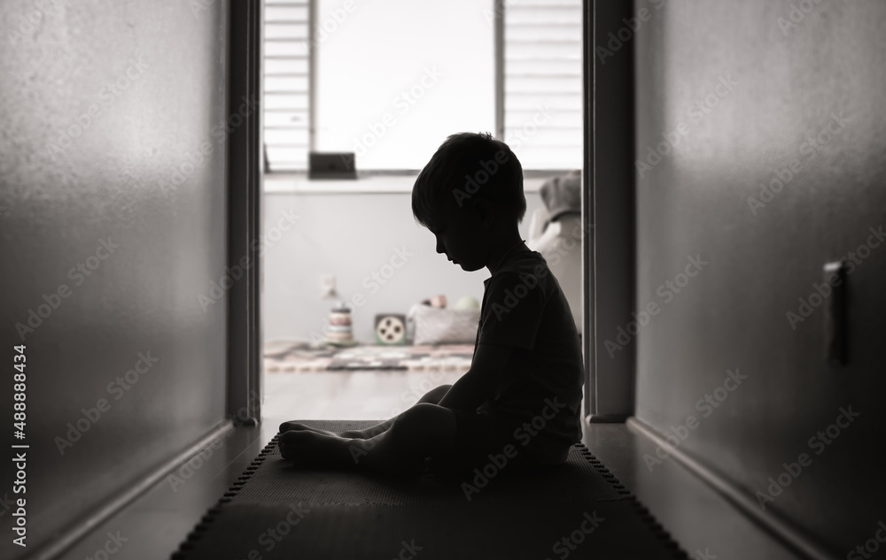 Sad little boy alone at home suffering from depression, bullying, abuse ...