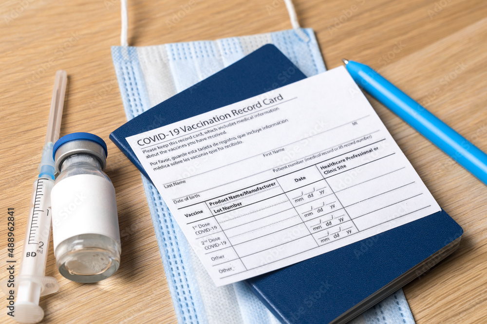 COVID-19 vaccination record card and tourist passport for worldwide ...