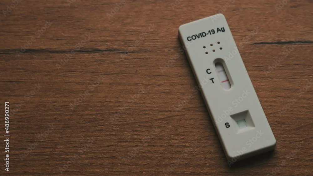 Positive Antigen Rapid Test for Coronavirus. Stock Video | Adobe Stock