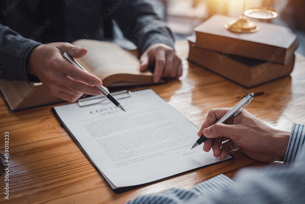 Attorney discuss legal legal contract document with clients. Lawyer ...