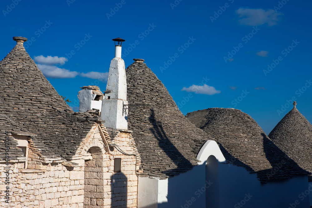 Trulli (traditional dry stone huts with the roof made of dry-set slabs ...