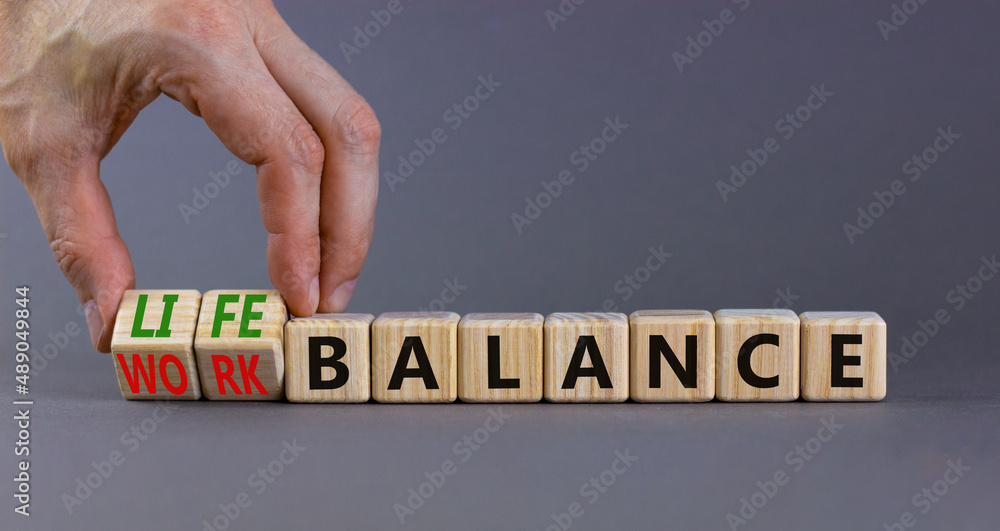 Work life balance symbol. Businessman turns cubes and changes concept ...
