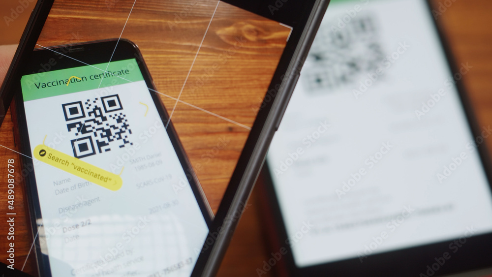 QR code, covid vaccination passport control close-up. Scanning ...